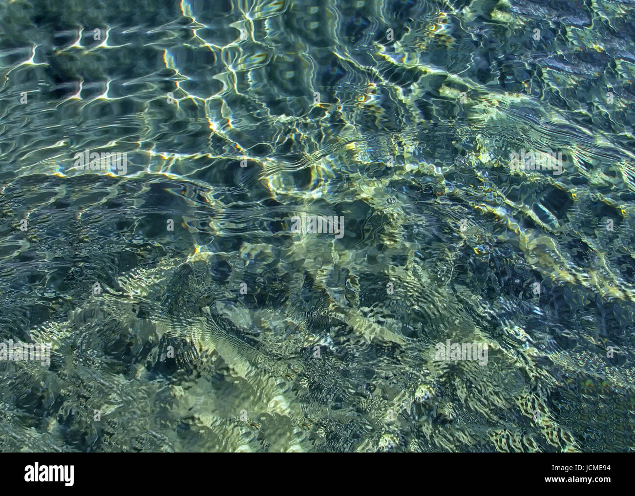 Beautiful natural background of pure sea water with a light pattern ...