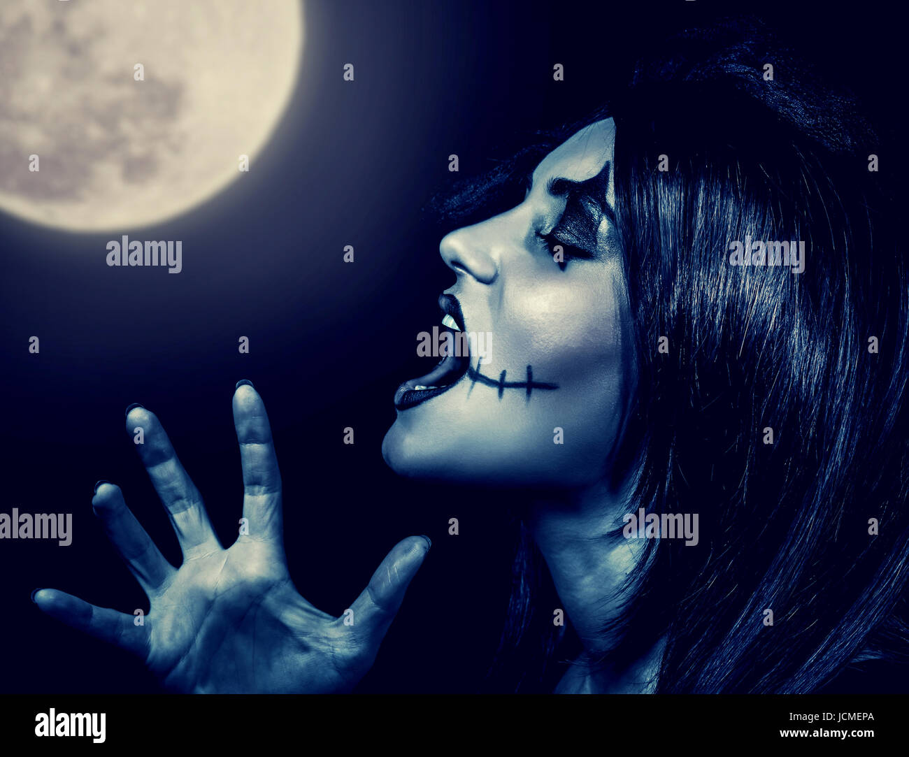 Closeup portrait of terrifying witch yelling in full moon, aggressive ...