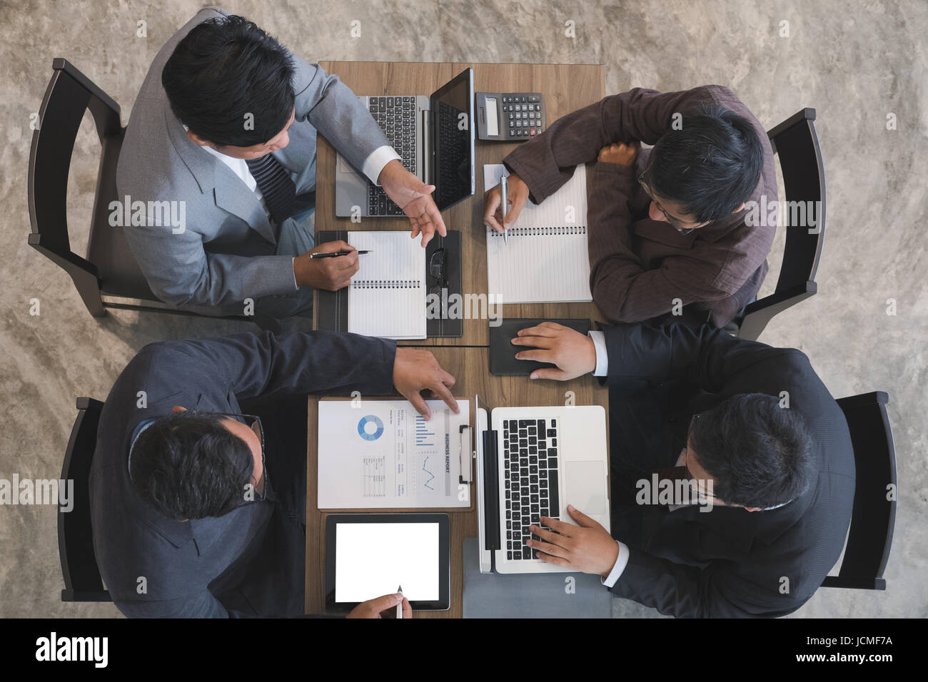 young business people and entrepreneur having a meeting around table in ...