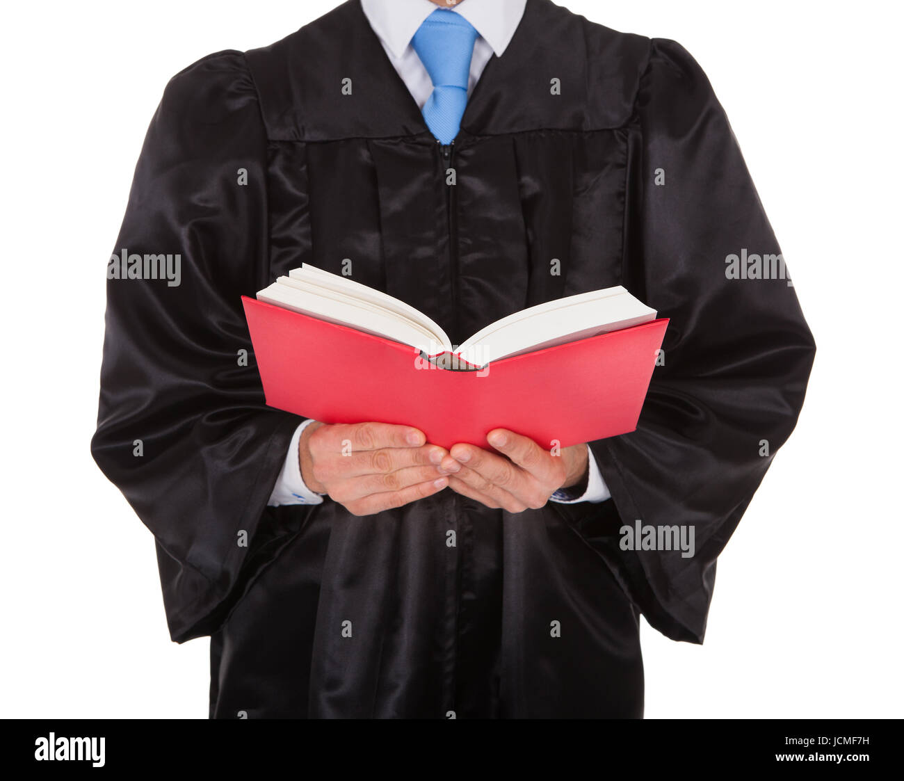 Midsection of judge holding statute book against white background Stock ...