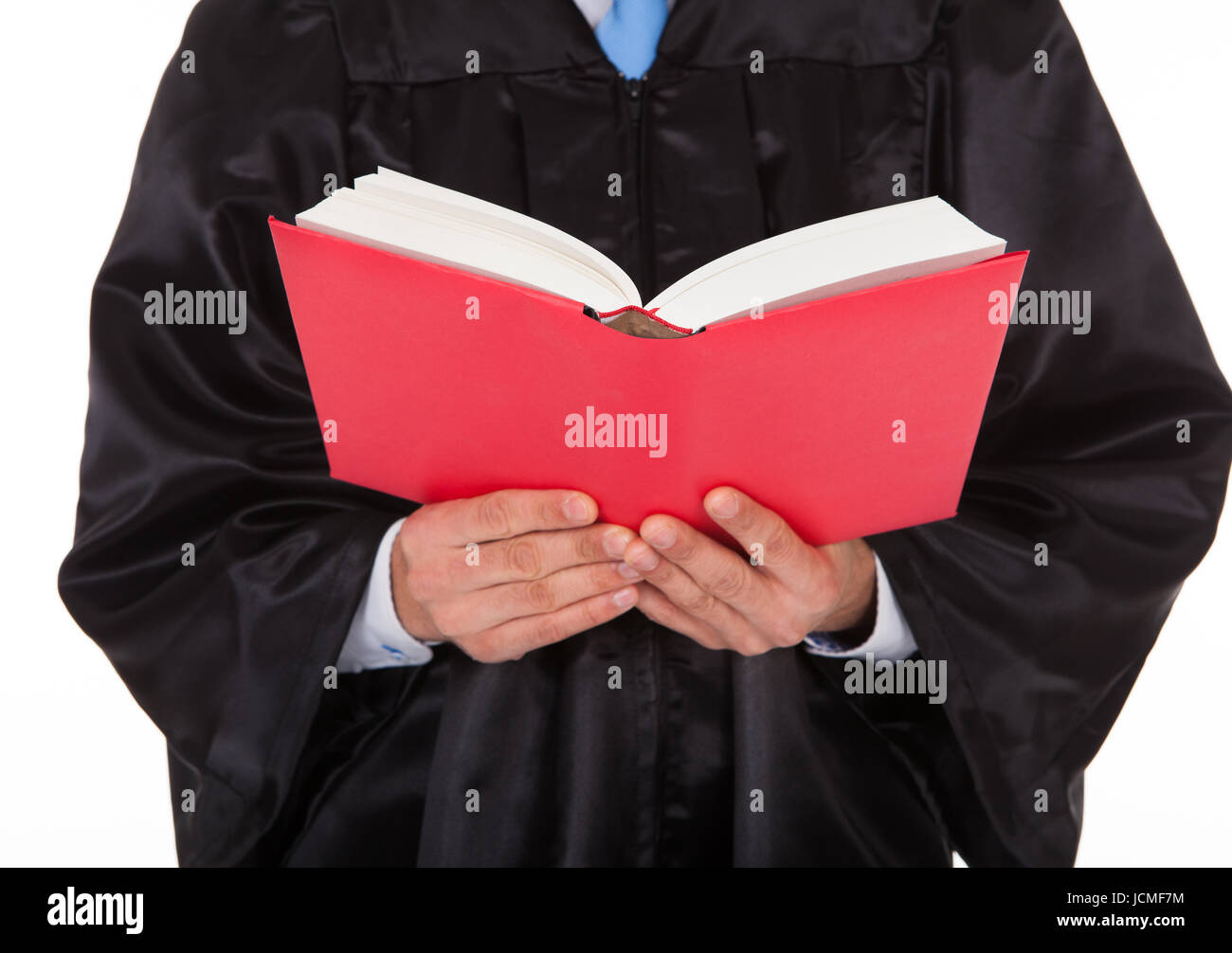 Midsection of judge holding statute book against white background Stock ...