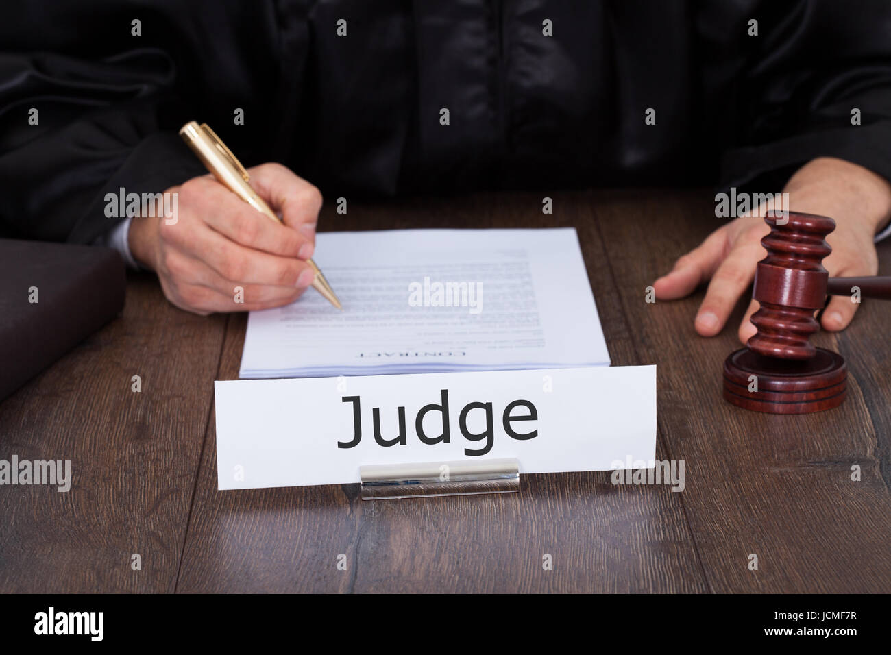 Judge writing criminal order hi-res stock photography and images - Alamy