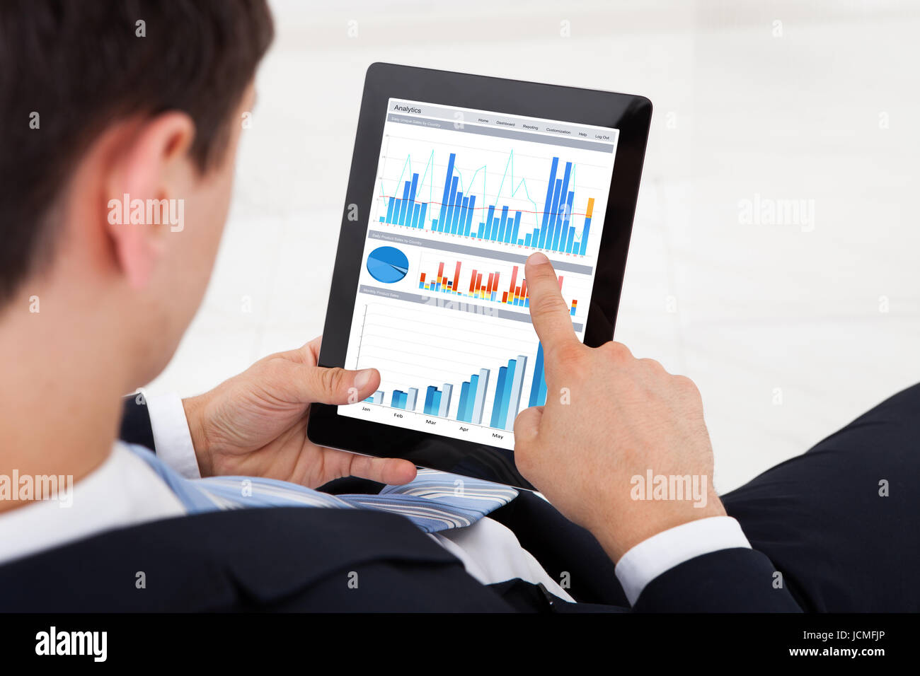 Young businessman comparing data on hi-res stock photography and images ...