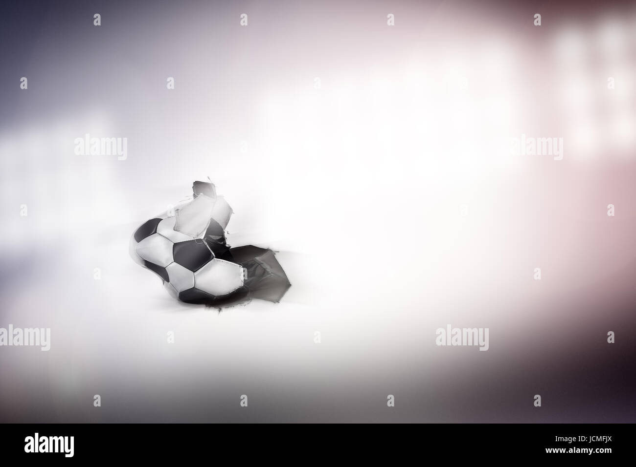 traditional football flying through the air after being hit so hard it ...