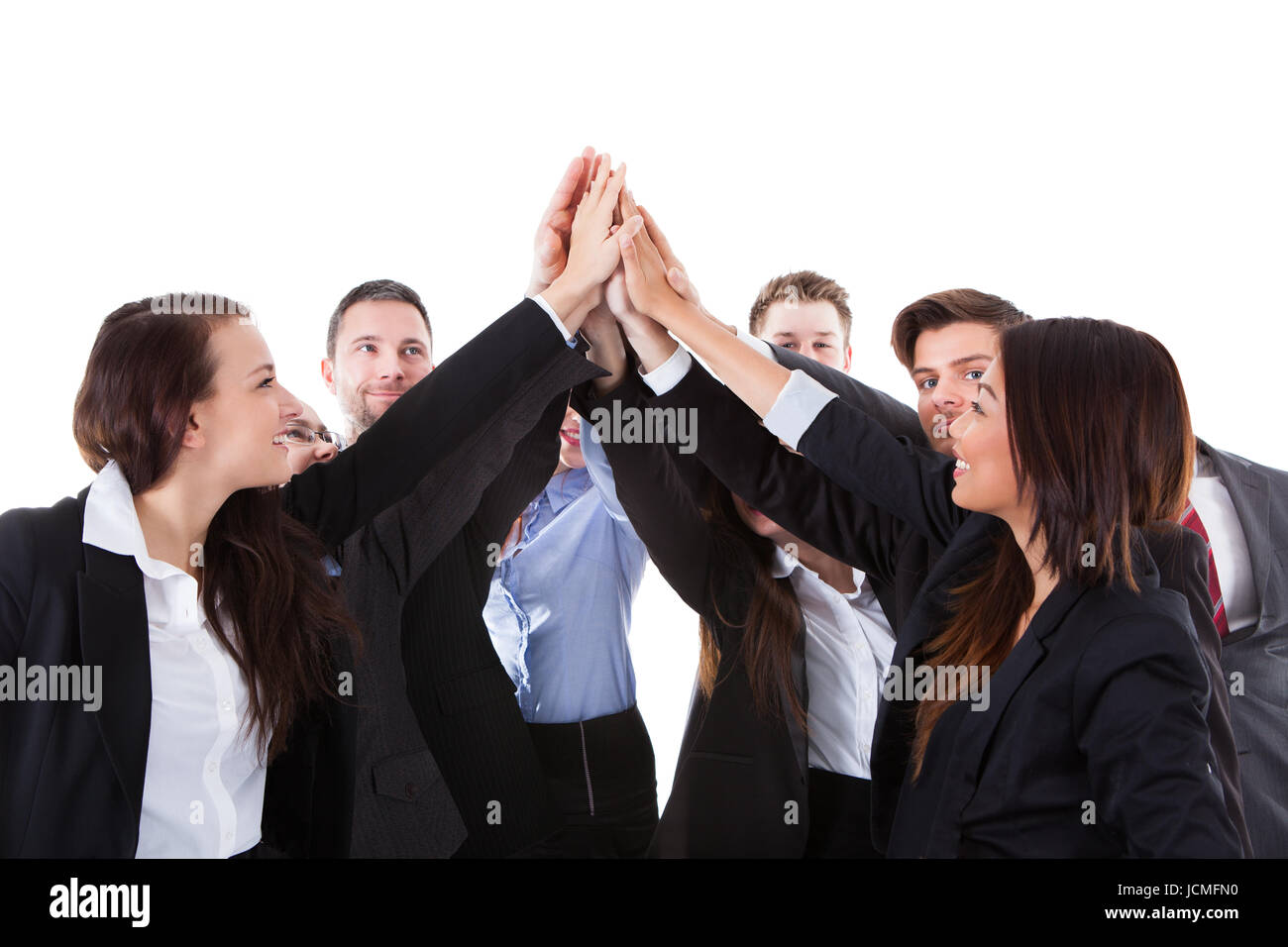 Businesspeople making high five gesture over white background Stock ...