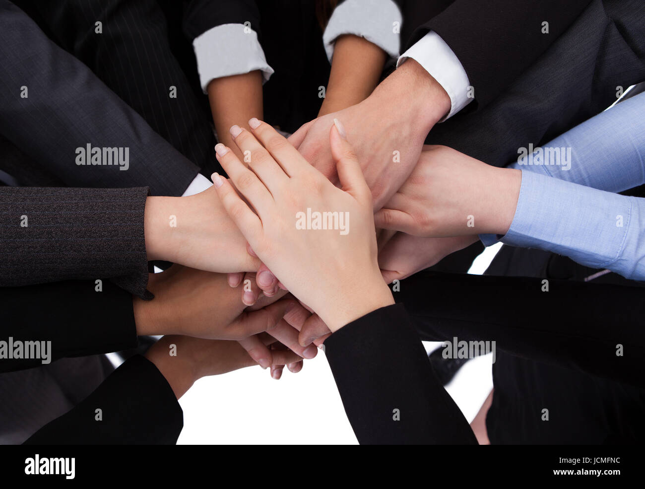 High angle close-up shot of business people stacking hands Stock Photo ...