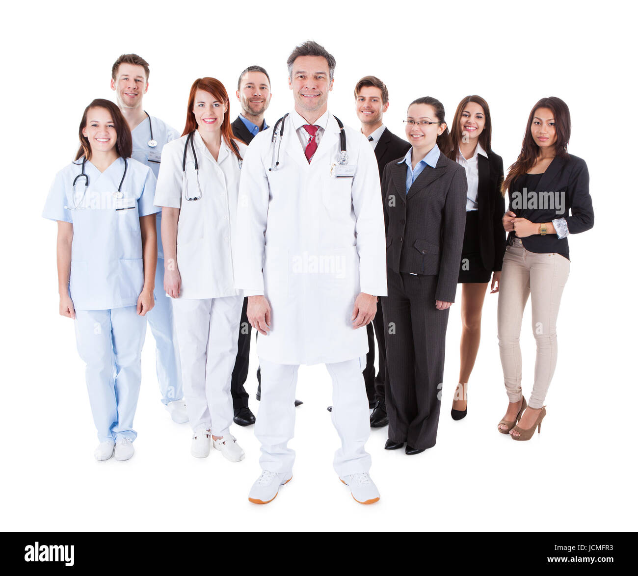 Doctor standing in front of his team. Isolated on white Stock Photo - Alamy