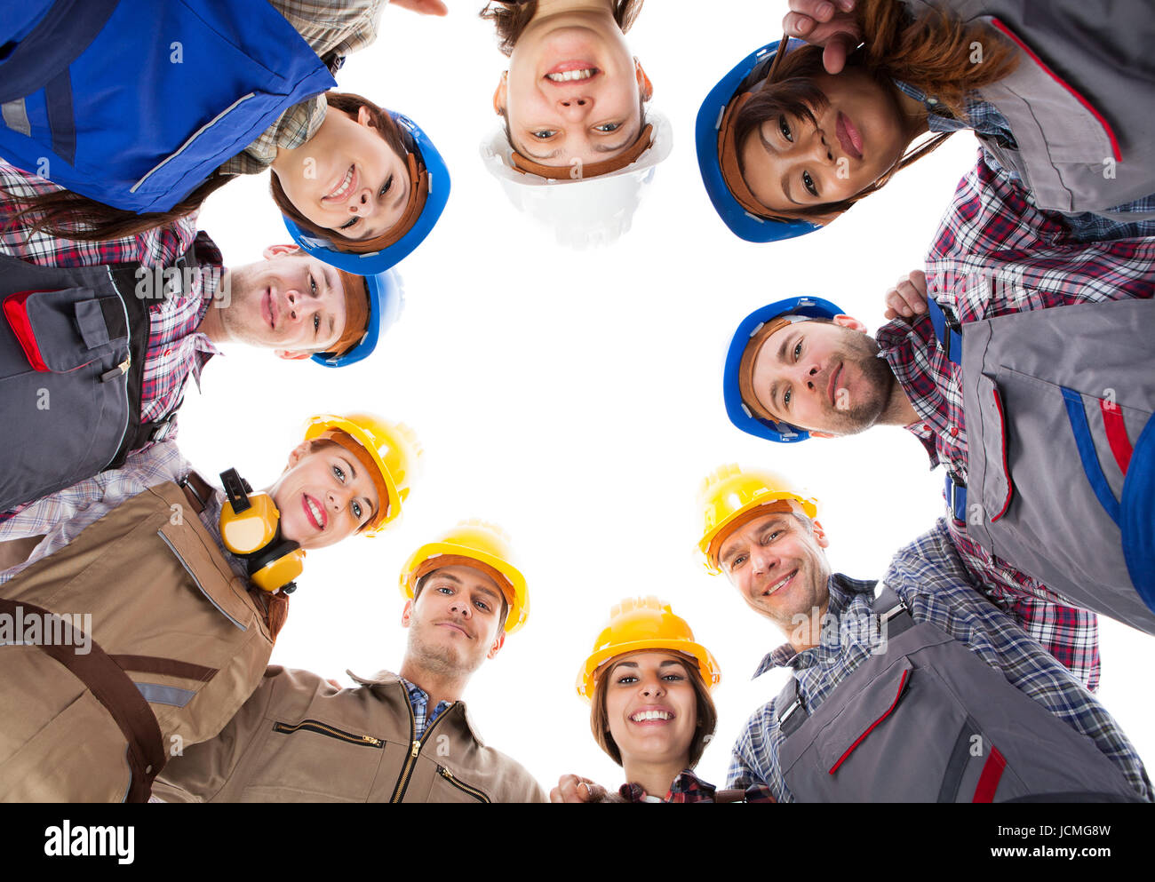 Large group of construction workers standing in circle. Isolated on ...