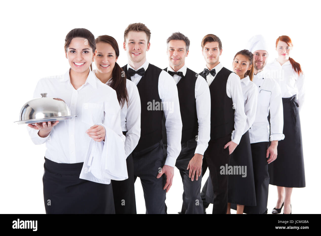 Large group of waiters and waitresses standing in row. Isolated on ...