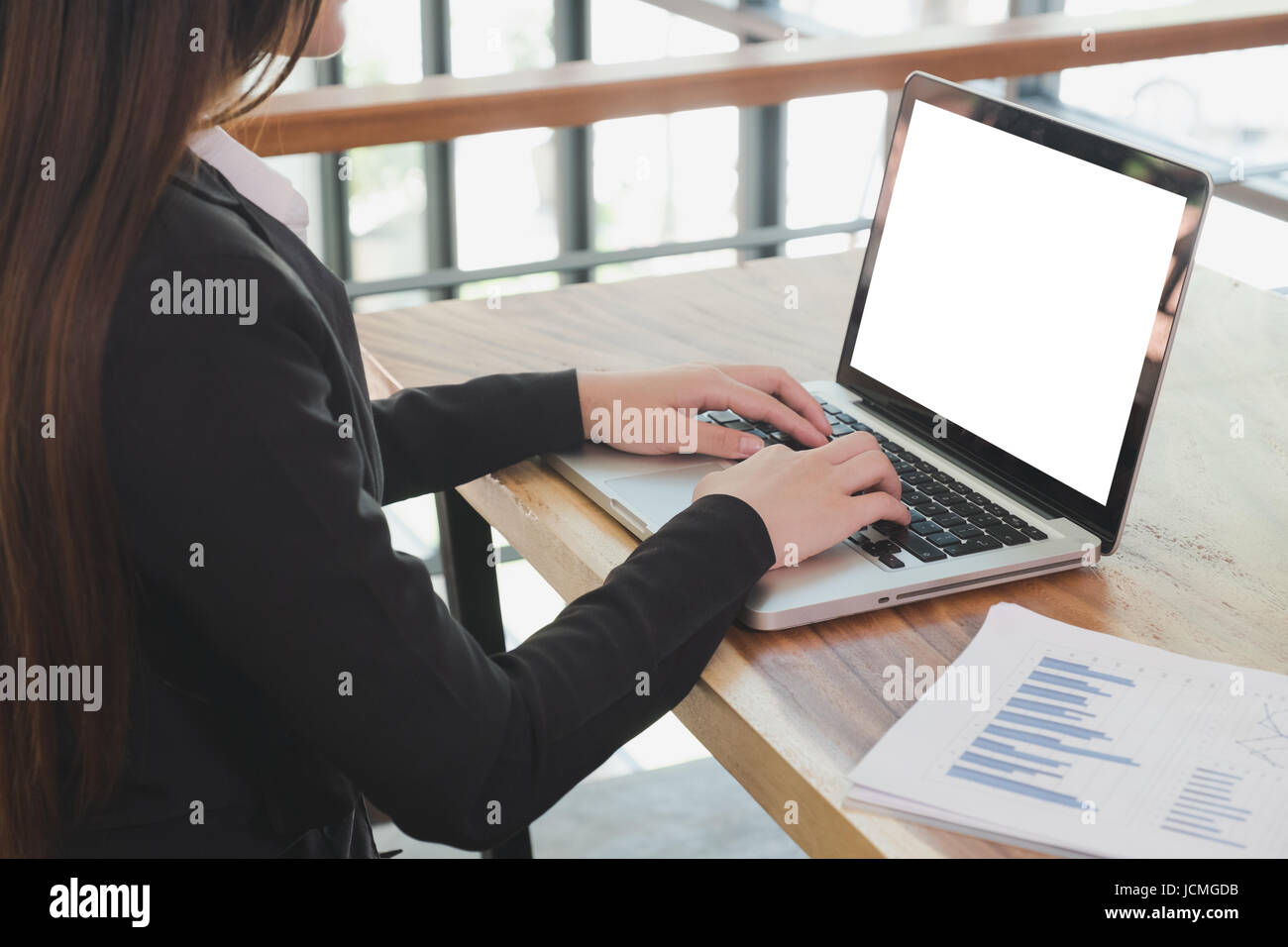 asian businesswoman using laptop computer at workplace. young female ...