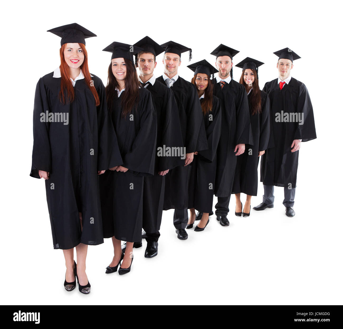 Graduate students standing in row. Isolated on white Stock Photo - Alamy