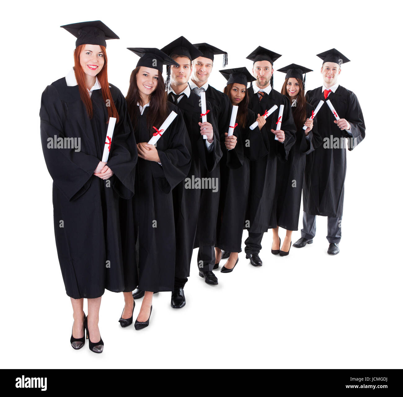 Graduate students standing in row holding diplomas. Isolated on white ...