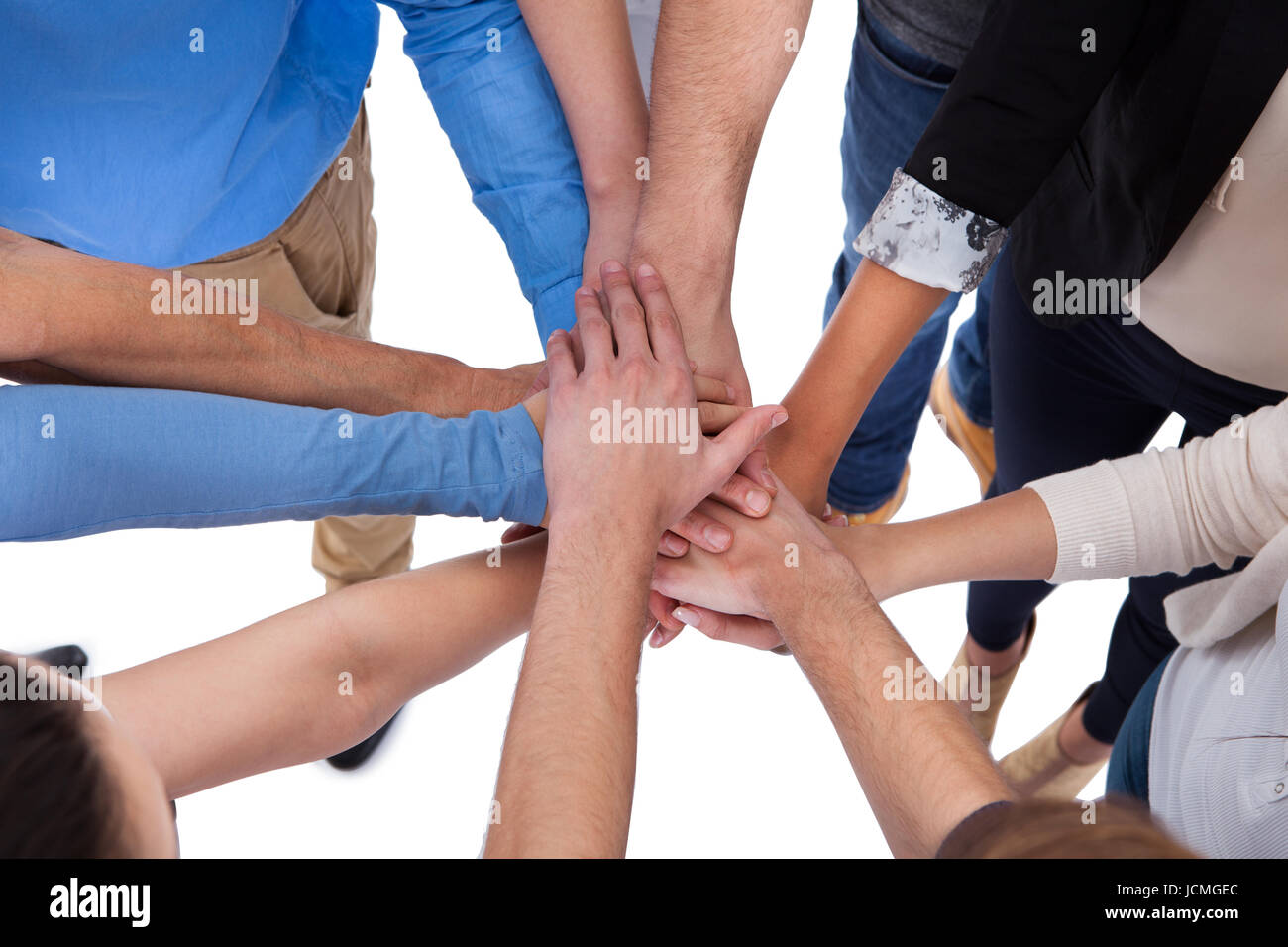 Group of people stacking hands together. Isolated on white Stock Photo ...