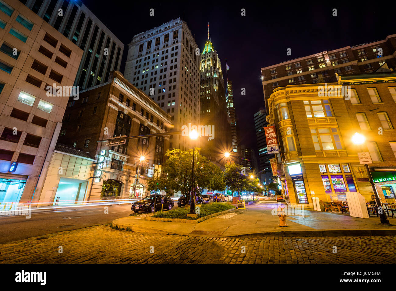 Water Street and buildings at night in downtown Baltimore, Maryland ...