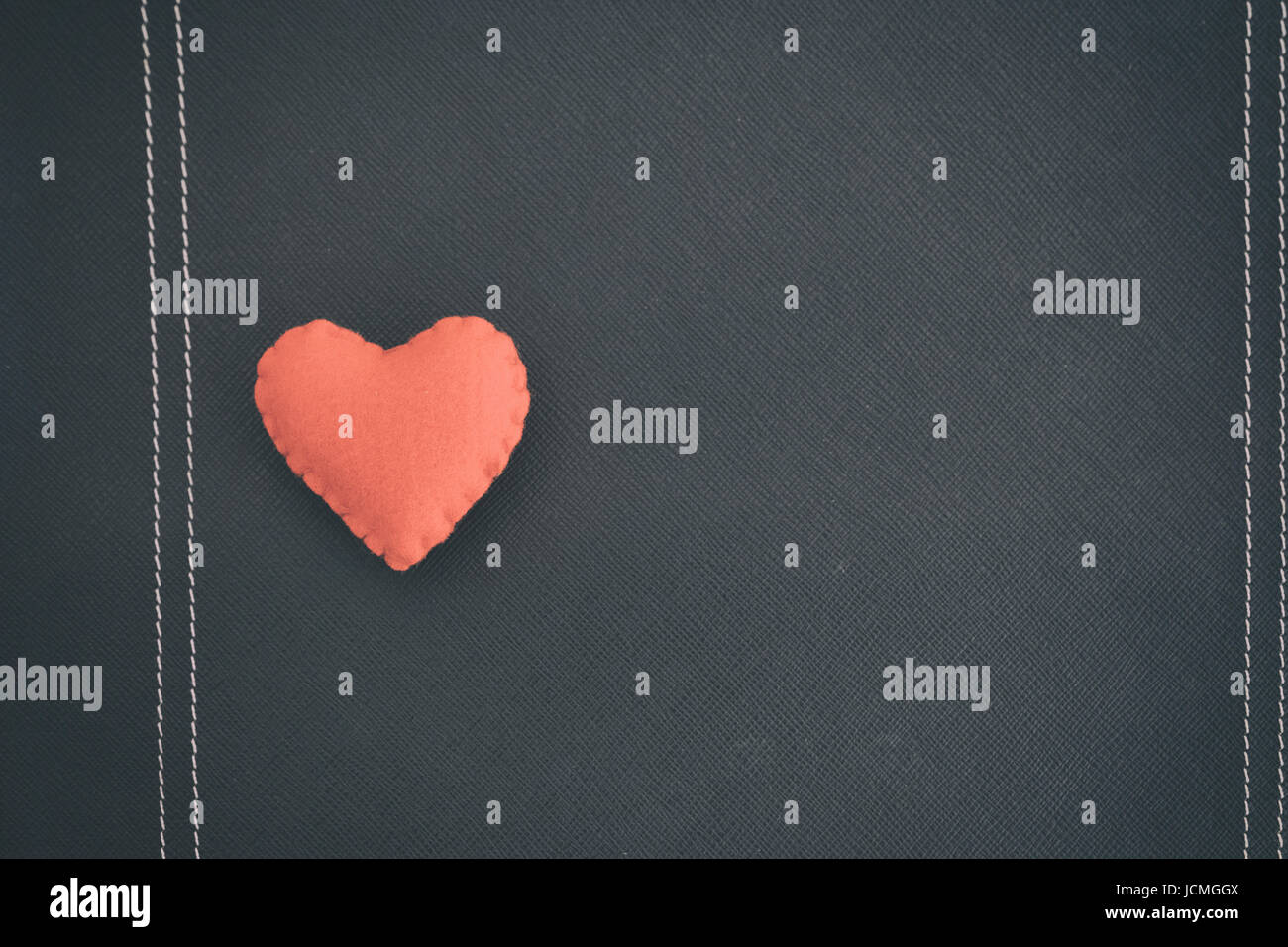 red heart on black book. love backdrop background Stock Photo - Alamy