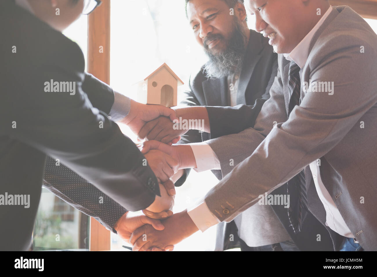 House developer and businessman shaking hands after finishing up a ...