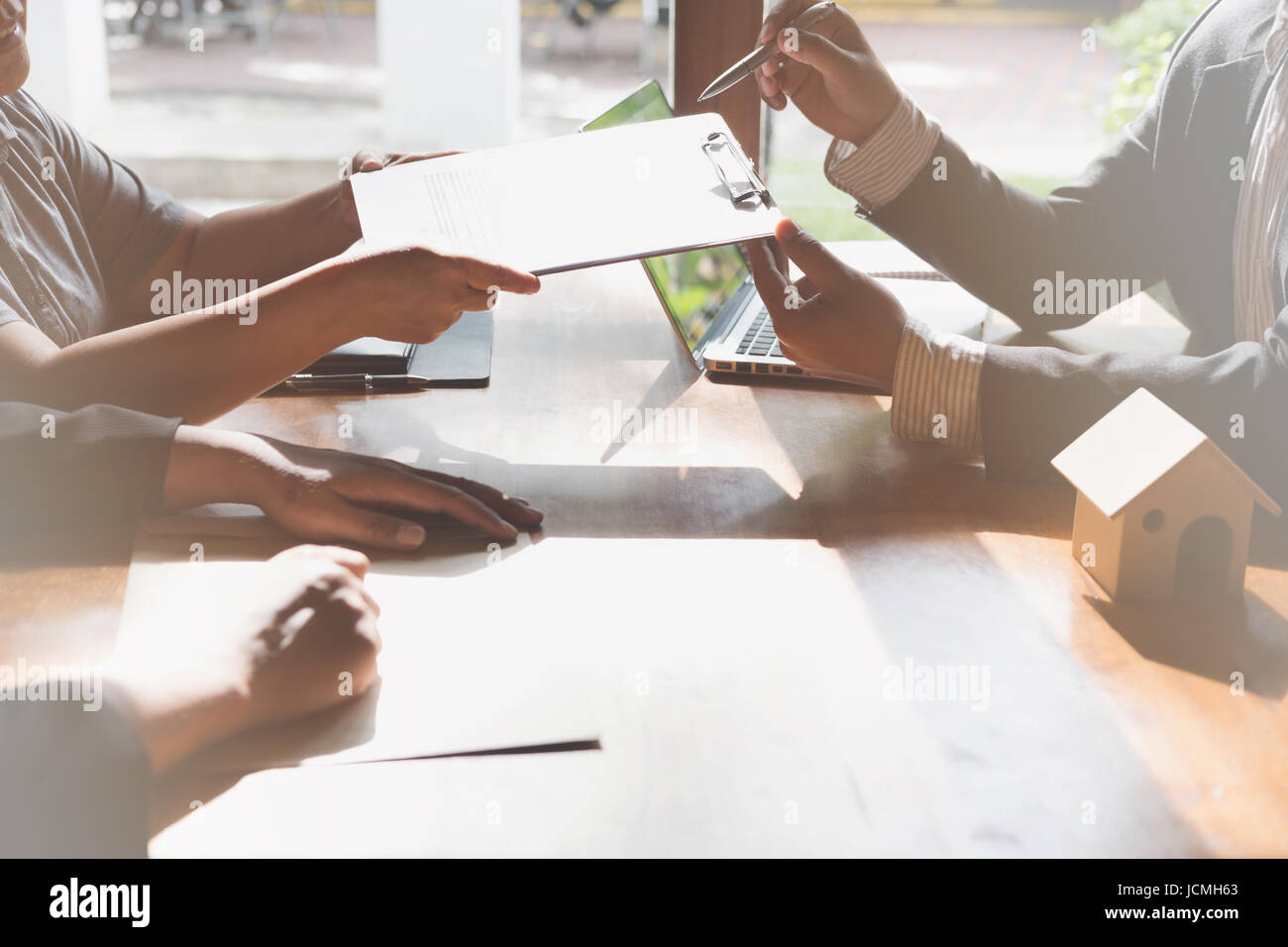 realtor talk with his clients. real estate agent have a deal with a ...