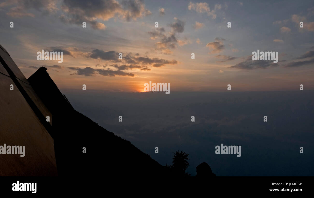 Sunrise over Mikeno Mountain, viewed from the crater rim of Nyiragongo ...