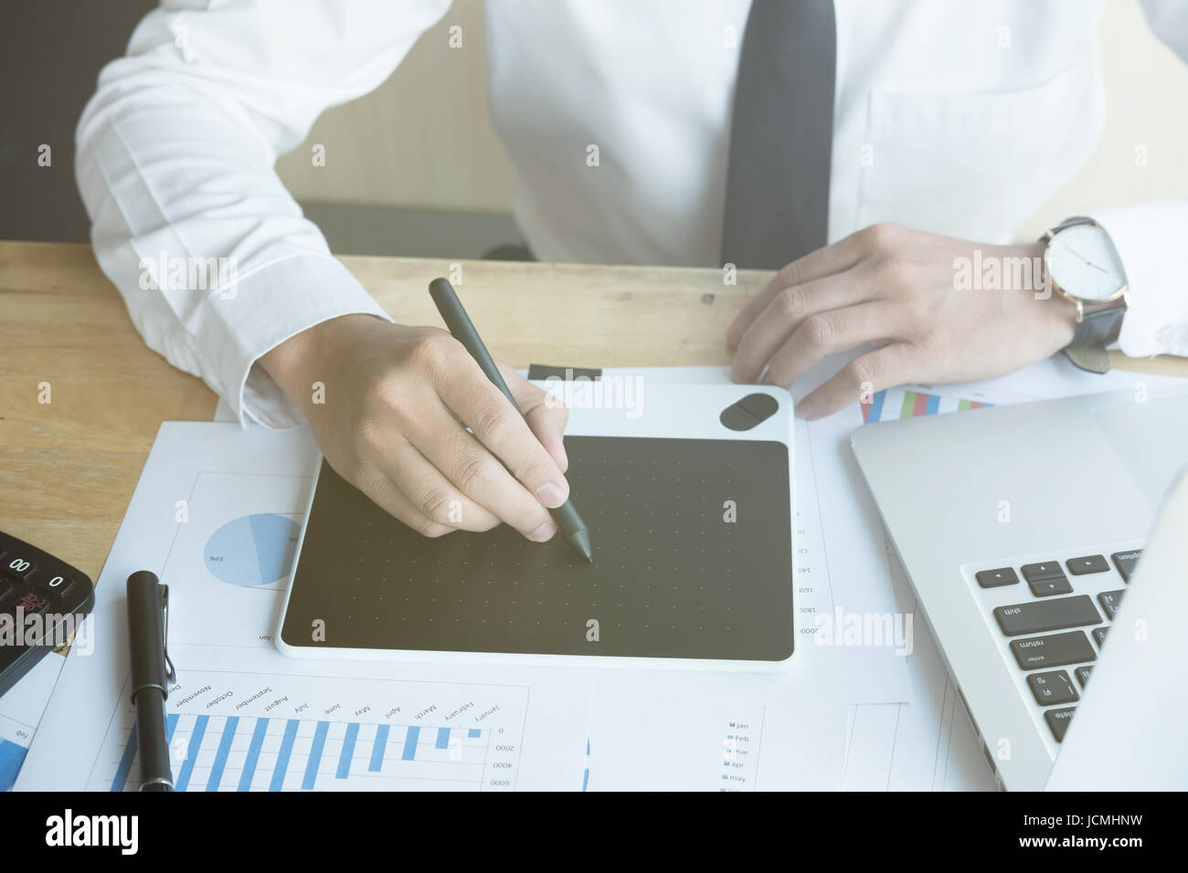 young male graphic designer working with computer. creative man using ...