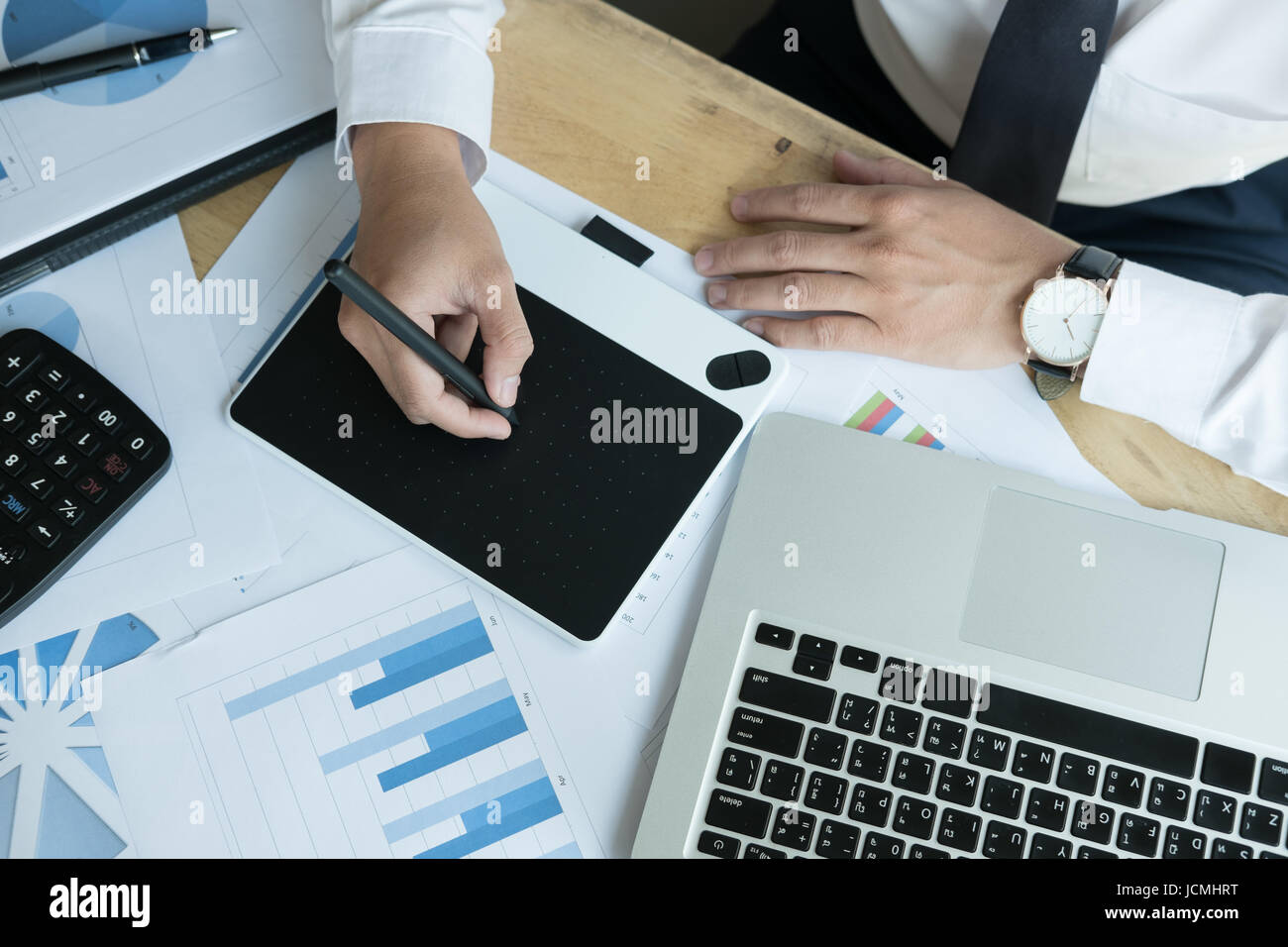 young male graphic designer working with computer. creative man using ...