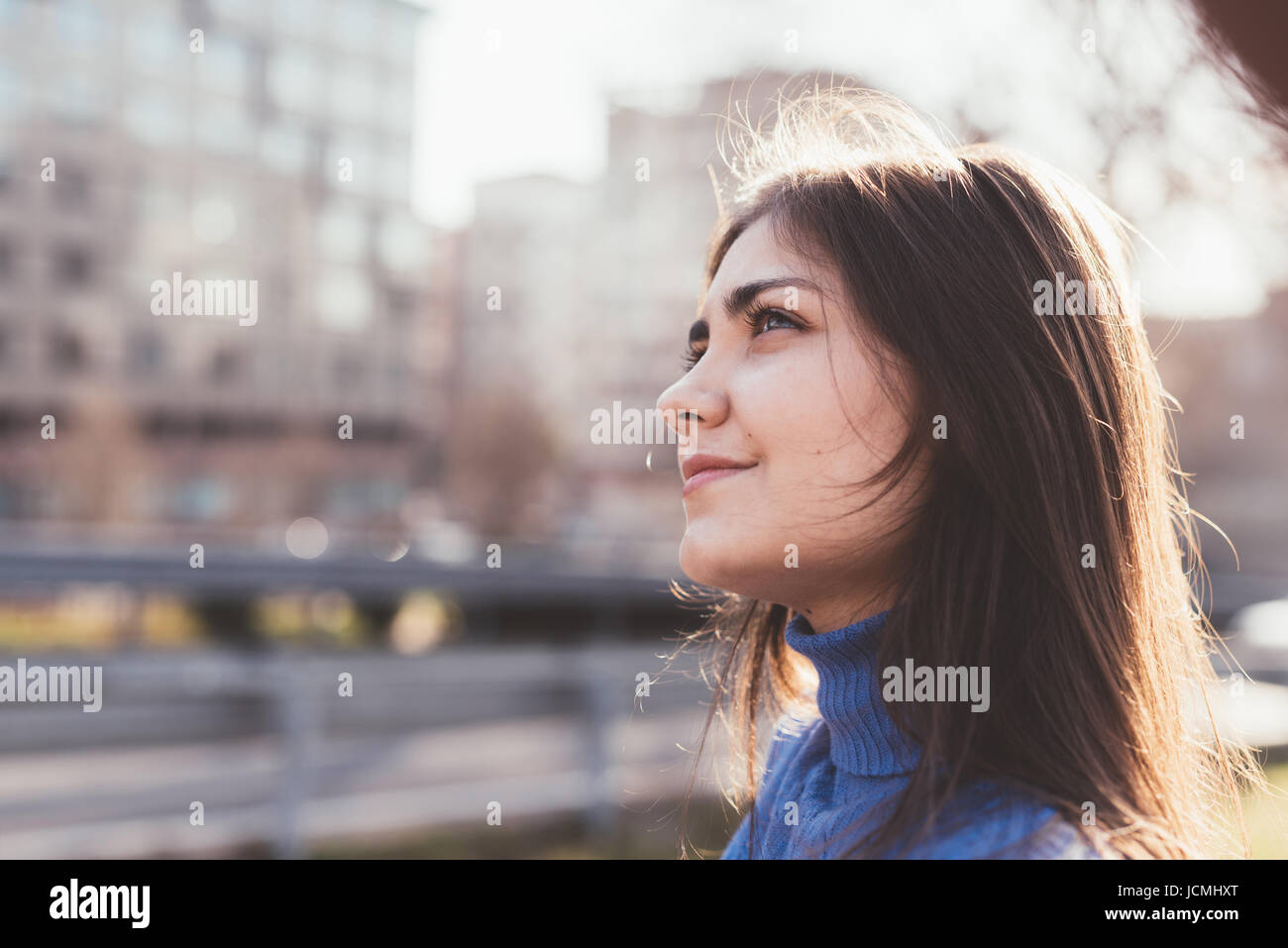 Portrait Young Woman Outdoor Back Light Looking Away Smiling
