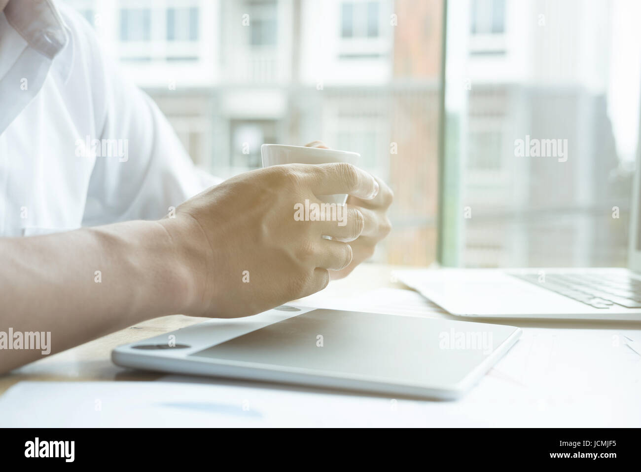young male graphic designer working with computer. creative man using ...