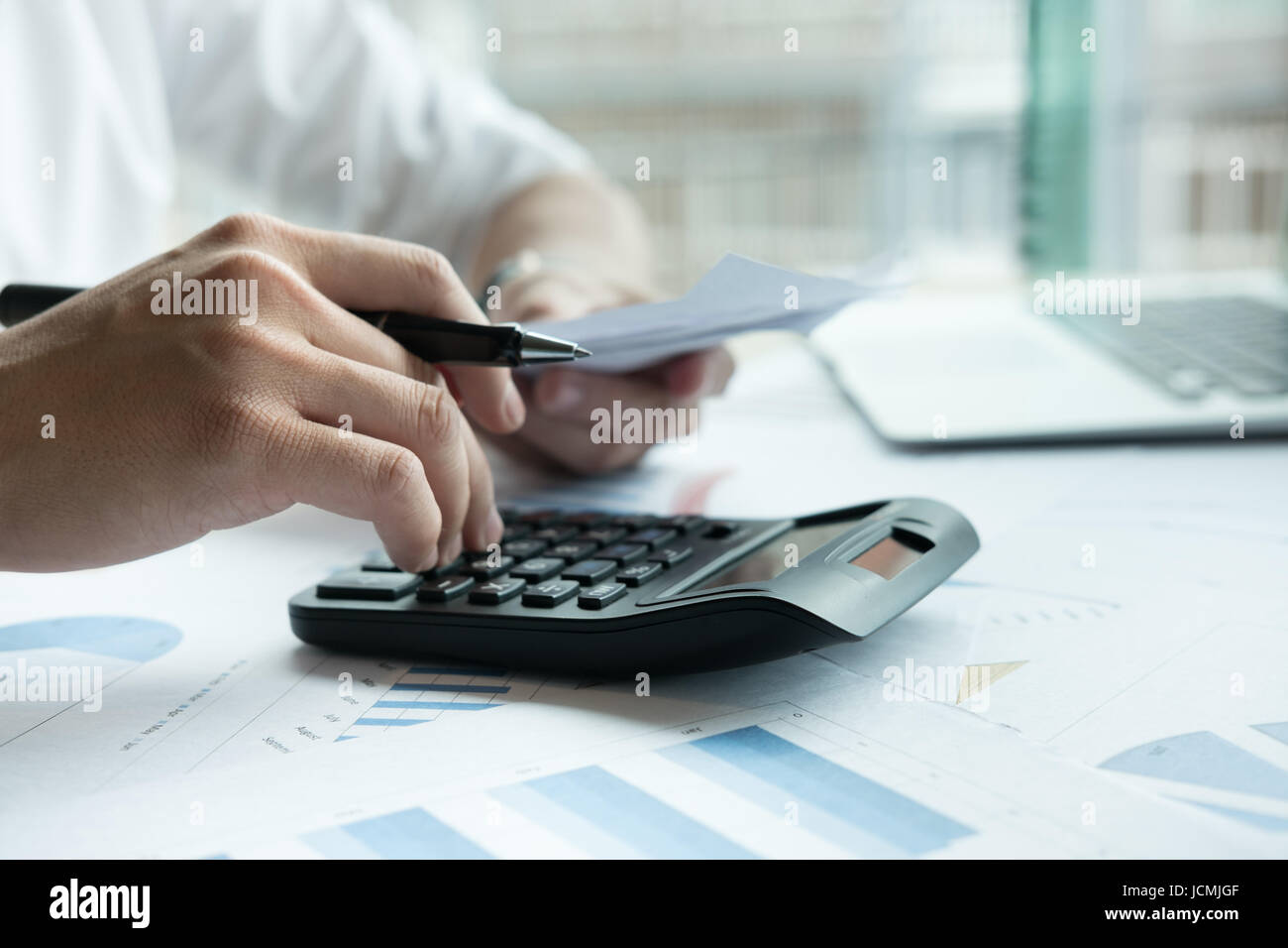 Man calculate domestic bills at home. Businessman using calculator at ...