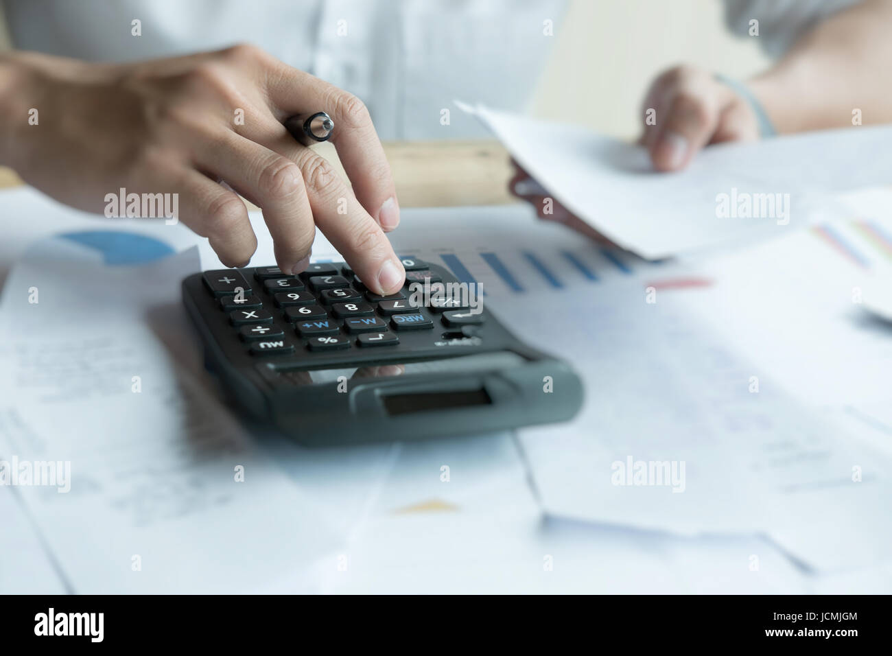 Man calculate domestic bills at home. Businessman using calculator at ...