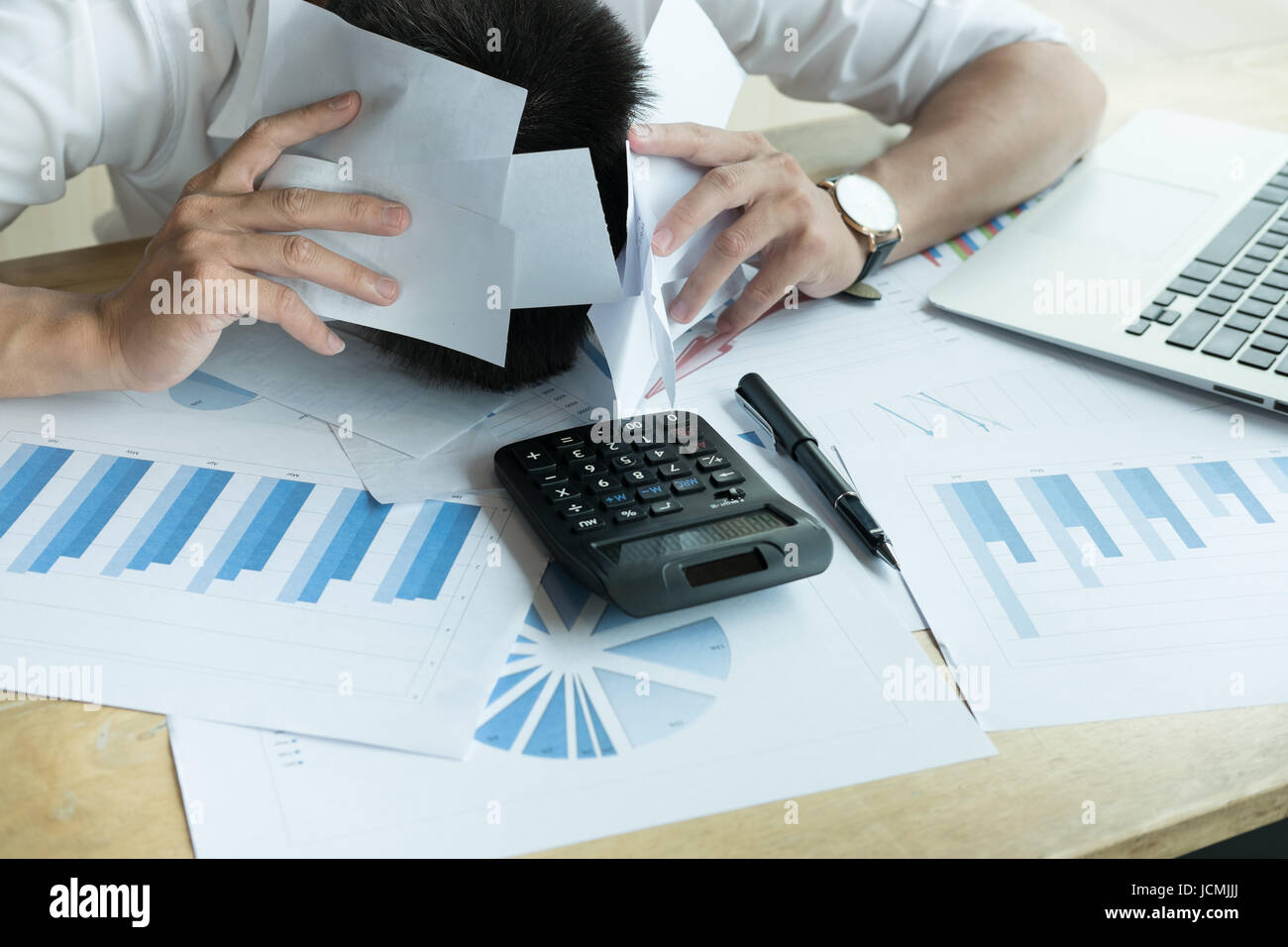 Man calculate domestic bills at home. Businessman using calculator at ...