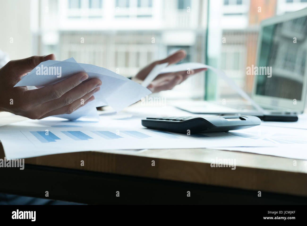 Man calculate domestic bills at home. Businessman using calculator at ...