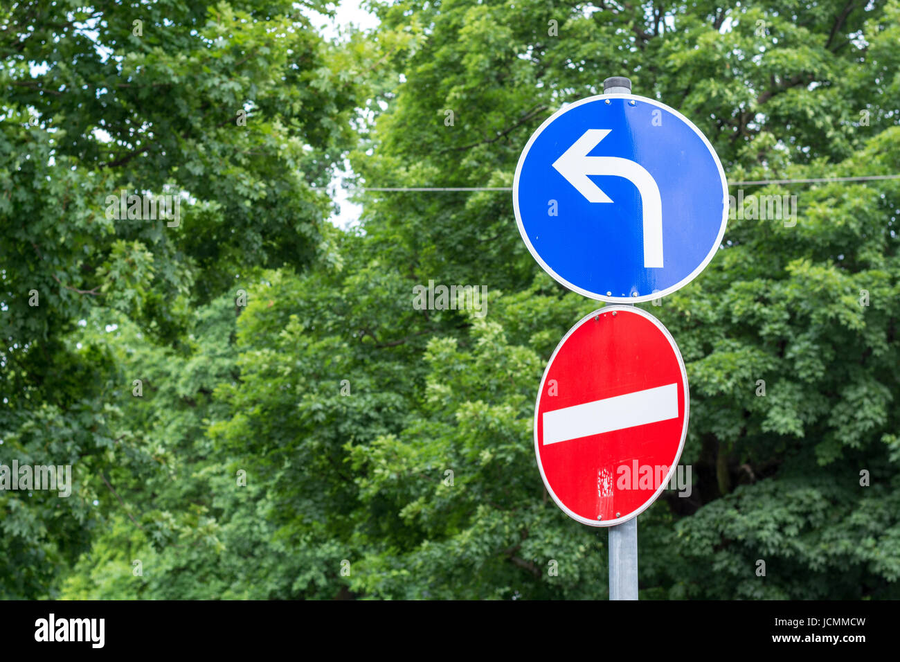 Two street signs showing wrong direction and having to turn left Stock ...