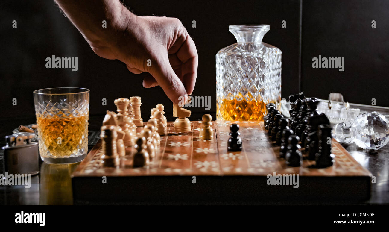 Playing a game of chess with a glass of whiskey and a cigar Stock Photo ...