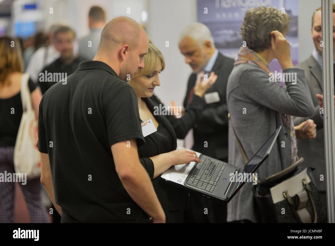 Business people using a laptop at a business conference. England. UK ...