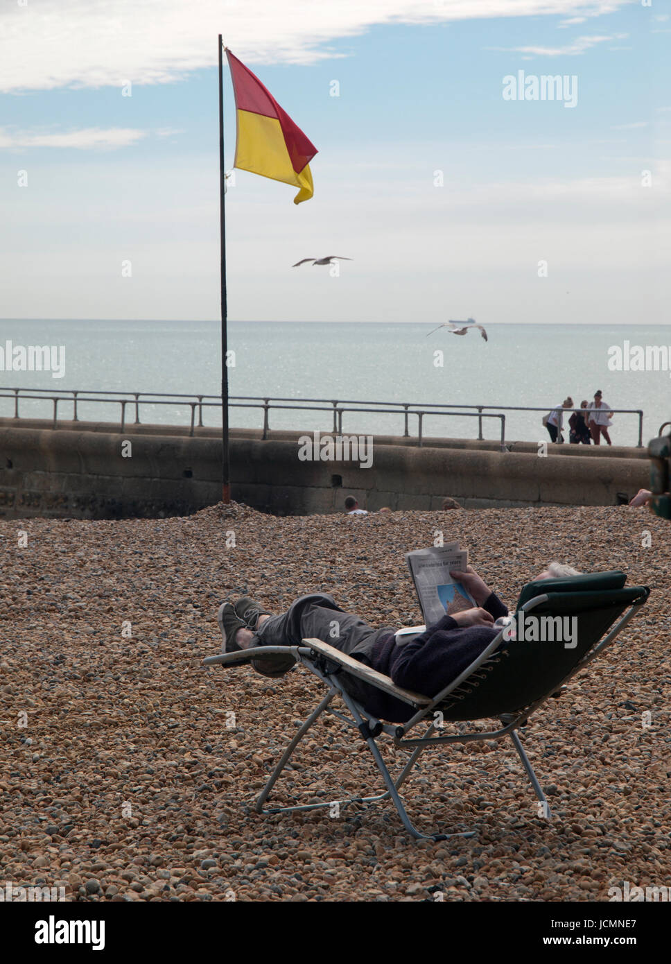 Reading on the beach chair hi-res stock photography and images - Alamy