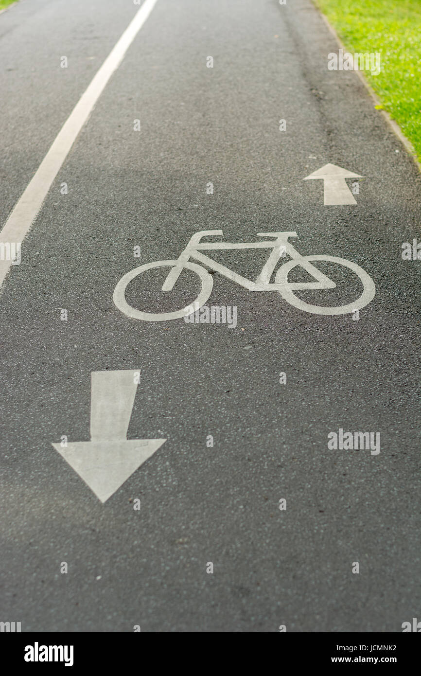A cycling lane sign on an asphalt ground Stock Photo - Alamy