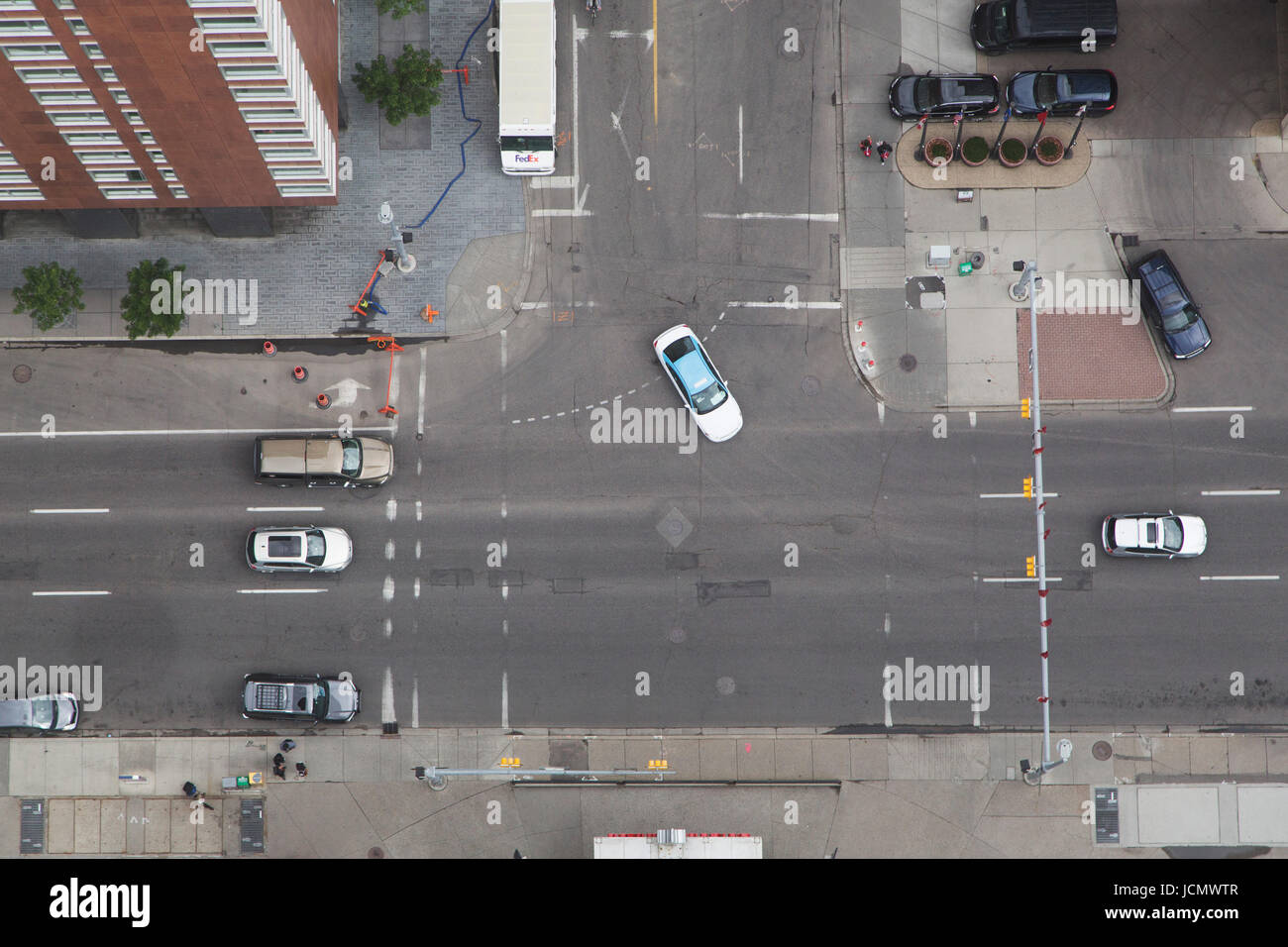 Vehicles on the street in downtown Calgary, Canada. The road junction ...