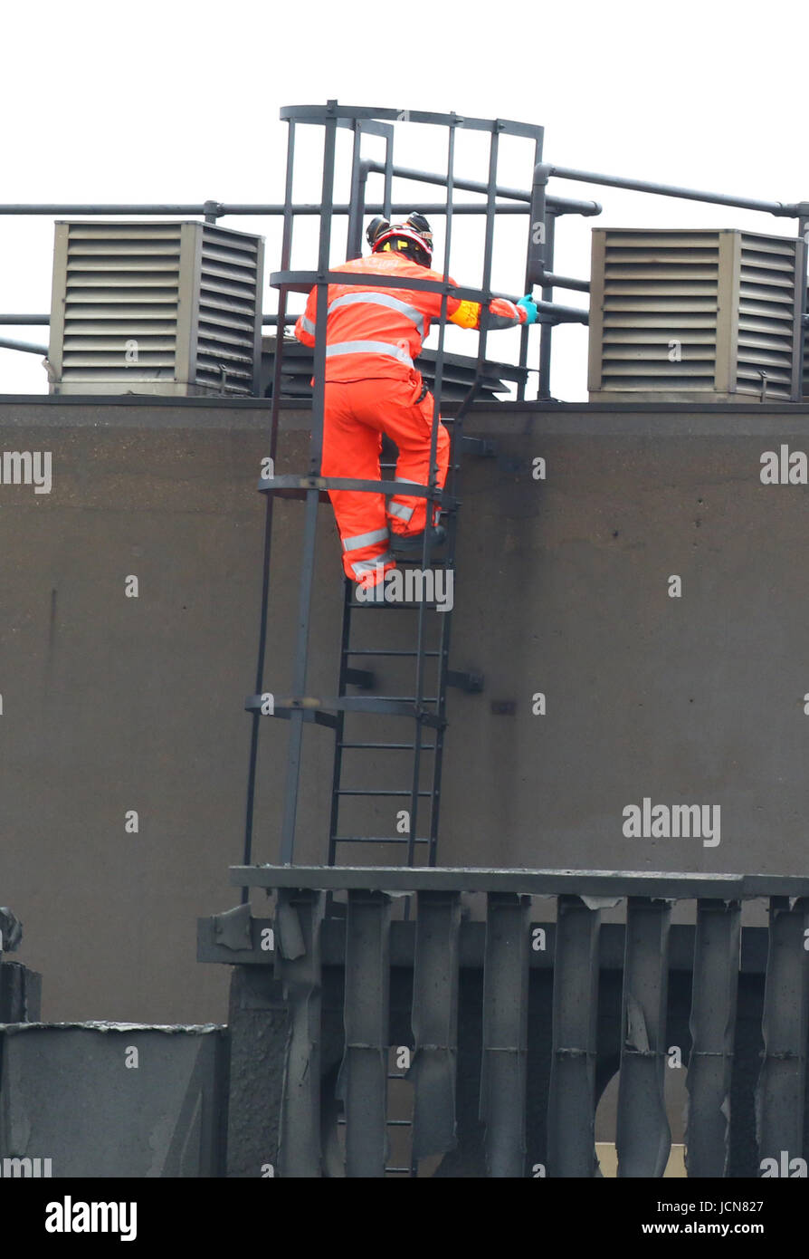 Emergency services personnel on top of Grenfell Tower in west London ...