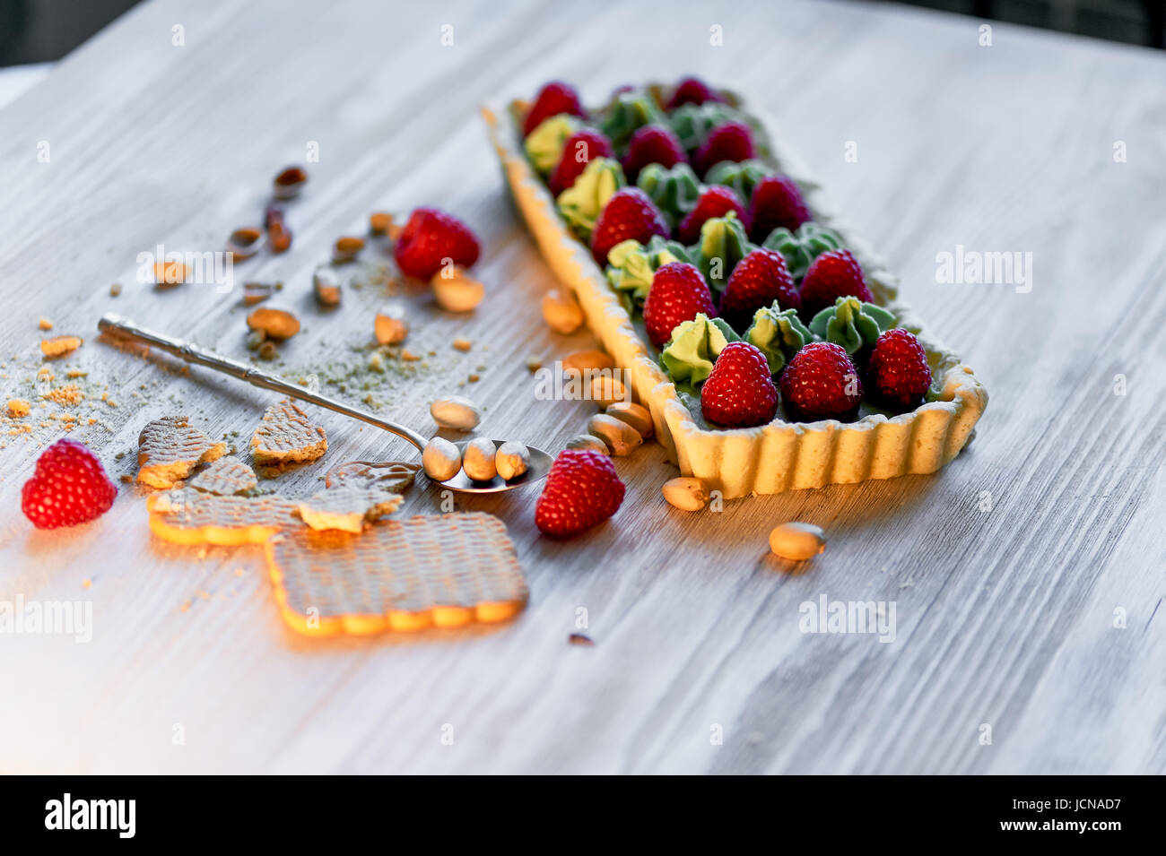 Pistachio tart. Pistachio tart on white Belgian chocolate BARRY with a ...