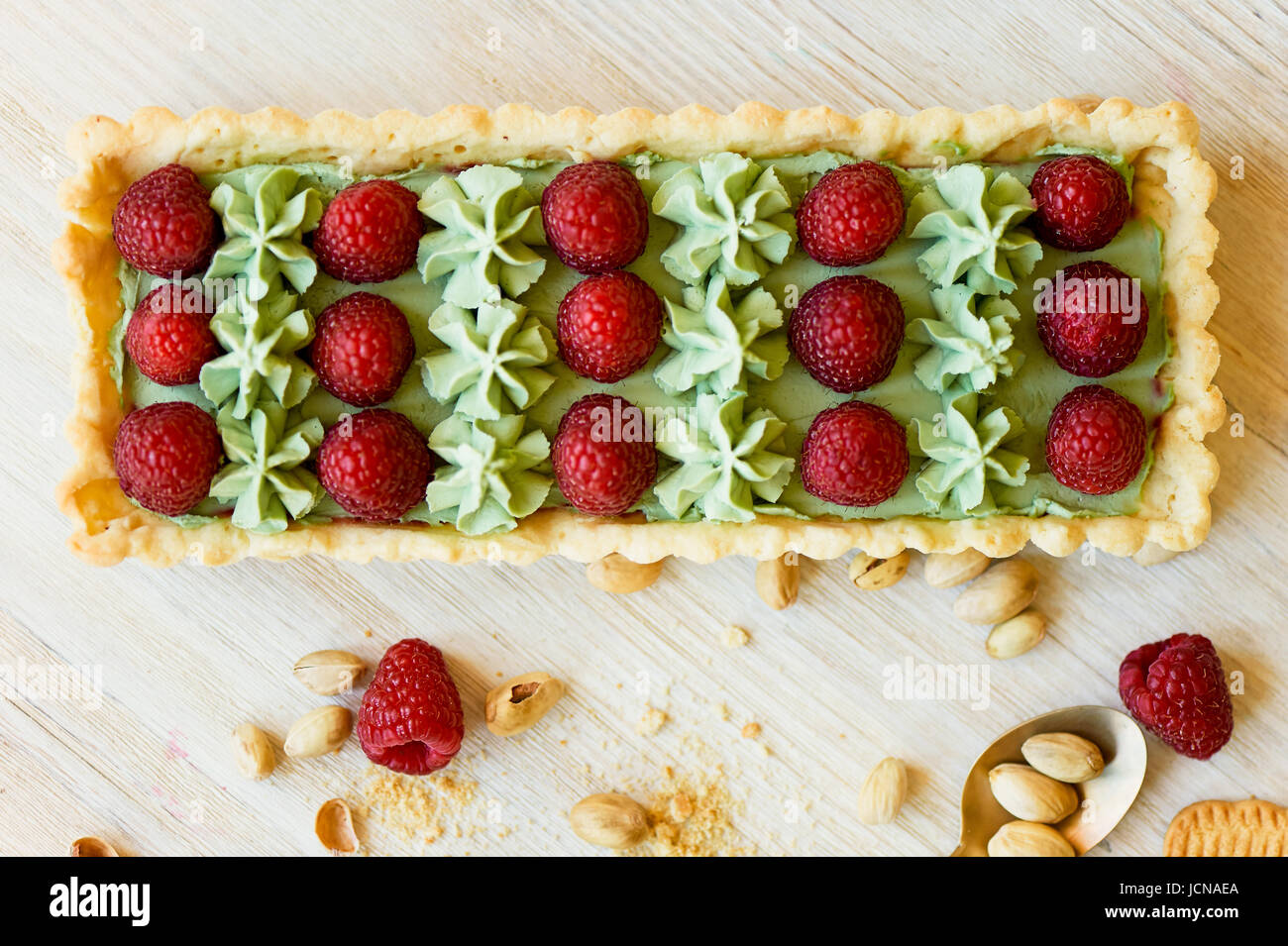 Pistachio tart. Pistachio tart on white Belgian chocolate BARRY with a ...