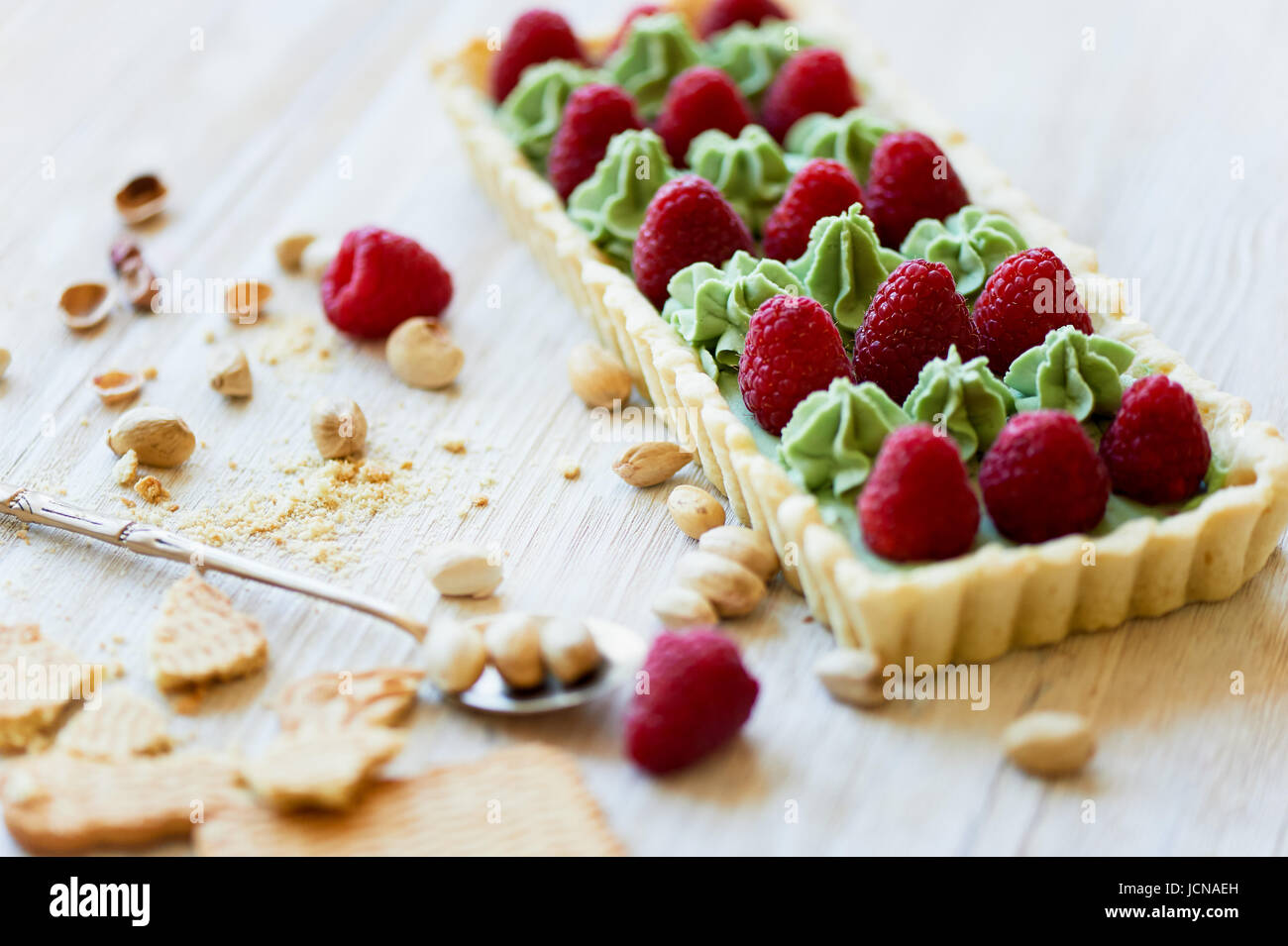 Pistachio tart. Pistachio tart on white Belgian chocolate BARRY with a ...