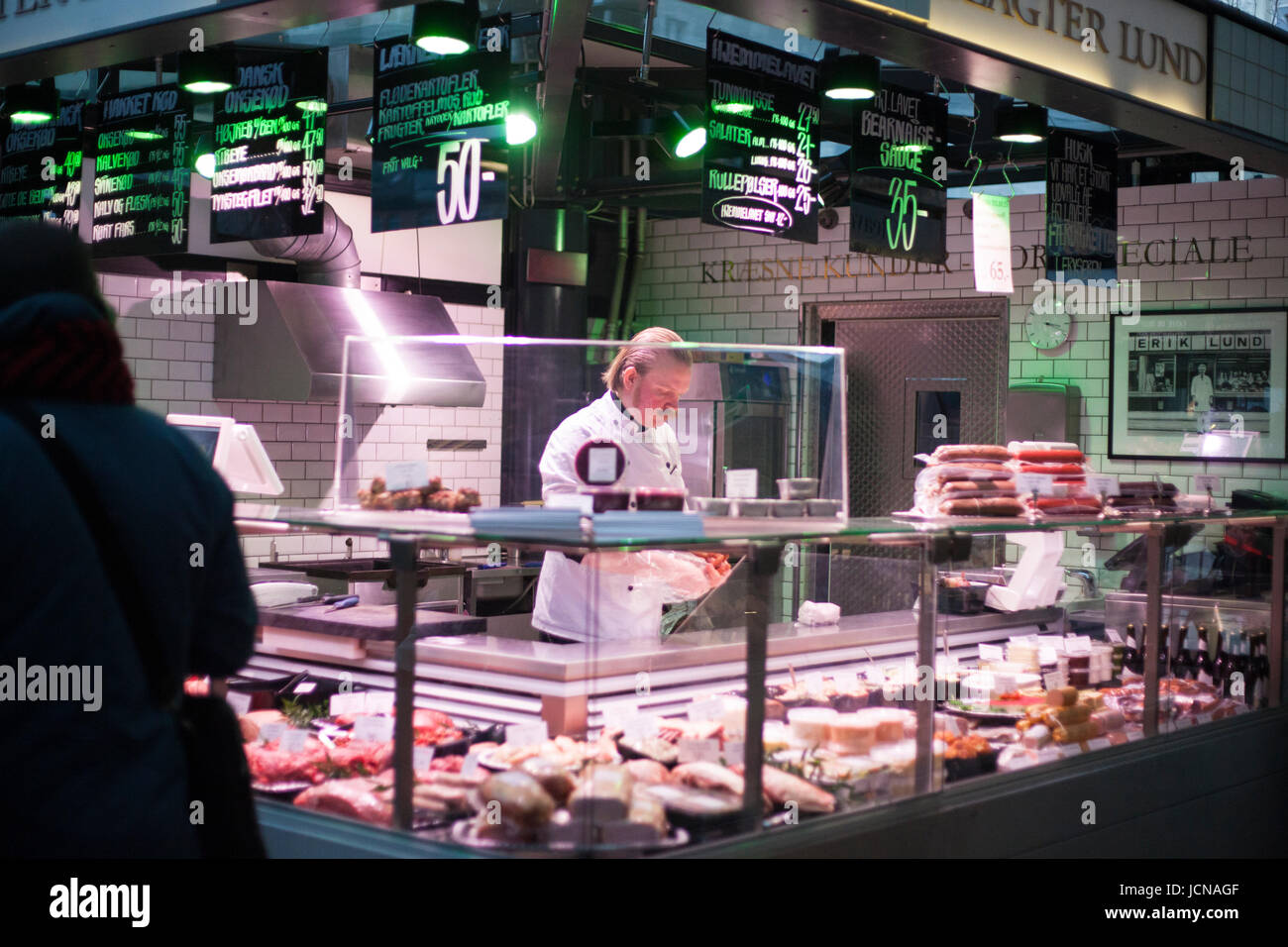 Butcher in Copenhagen food market Stock Photo - Alamy
