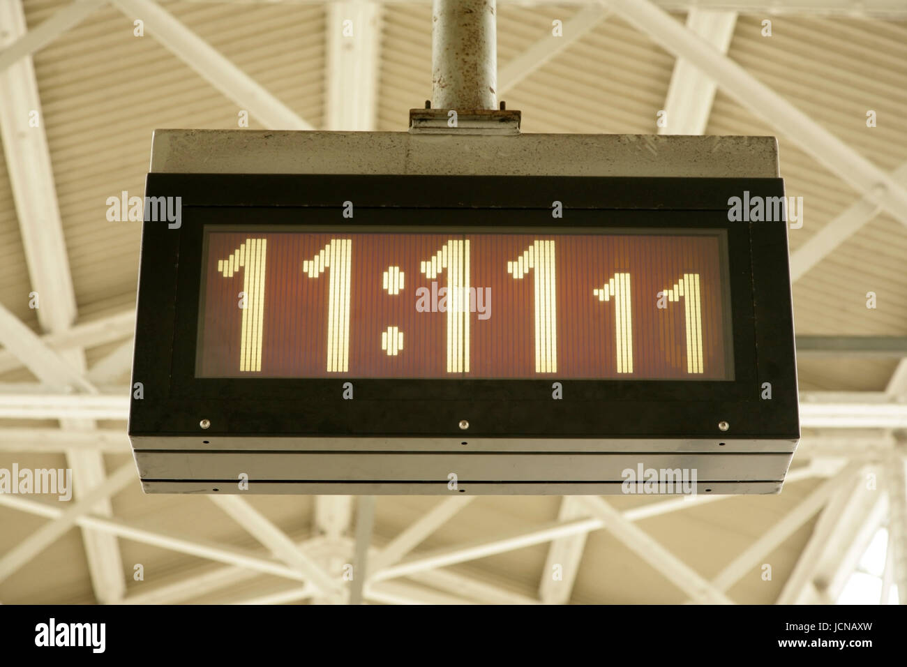 Digital clock reading eleven minutes and eleven seconds past eleven ...