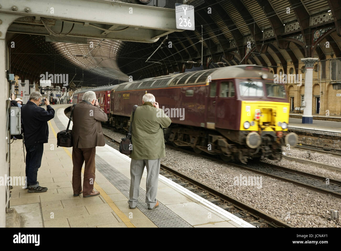 Rail enthusiasts photographing a West Coast Railways class 57 diesel ...
