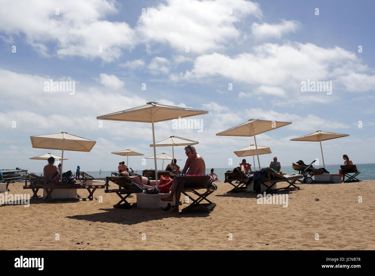 Tourists on the beach Stock Photo - Alamy