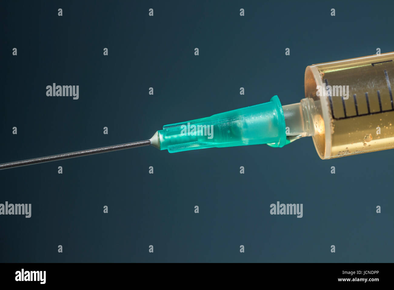 Detail of the connector of a hypodermic needle joined to a syringe with ...
