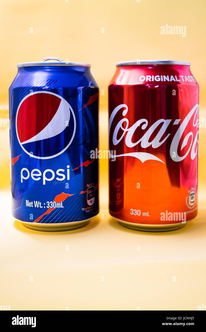 Pepsi and coca cola cans side by side hi-res stock photography and ...