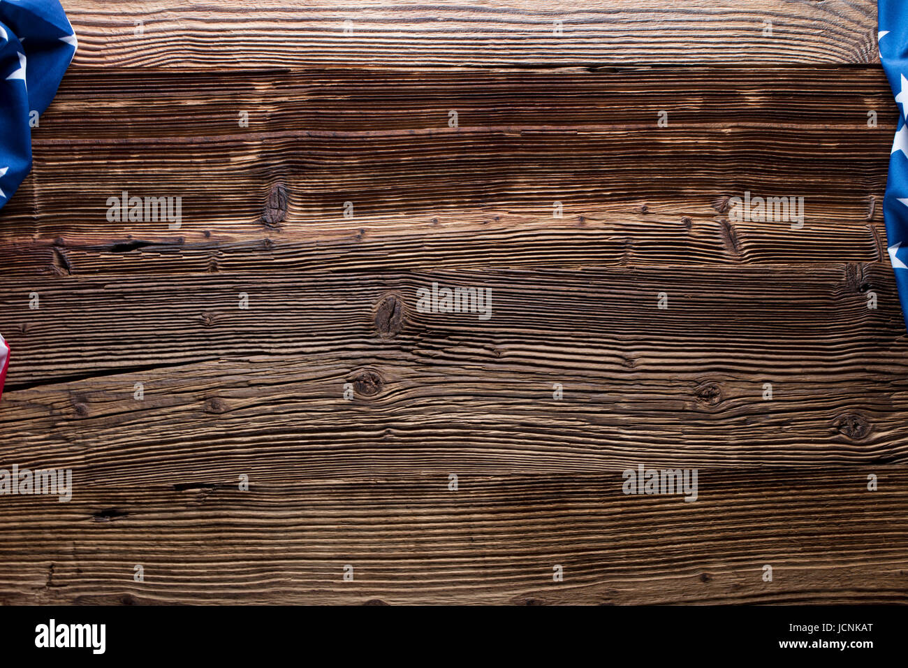 Independence Day concept. American flag on the wooden rustic table ...
