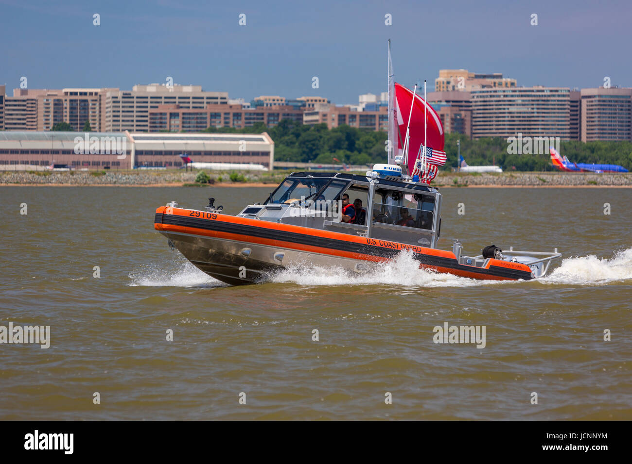 VIRGINIA, USA - U. S. Coast Guard boat on Potomac River passes by ...