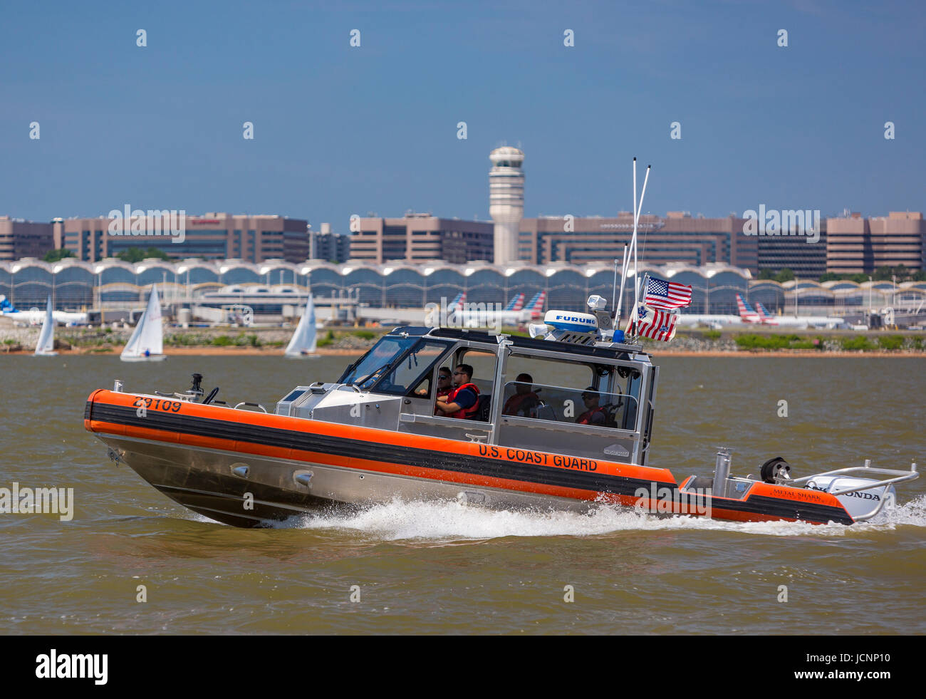 VIRGINIA, USA - U. S. Coast Guard boat on Potomac River passes by ...