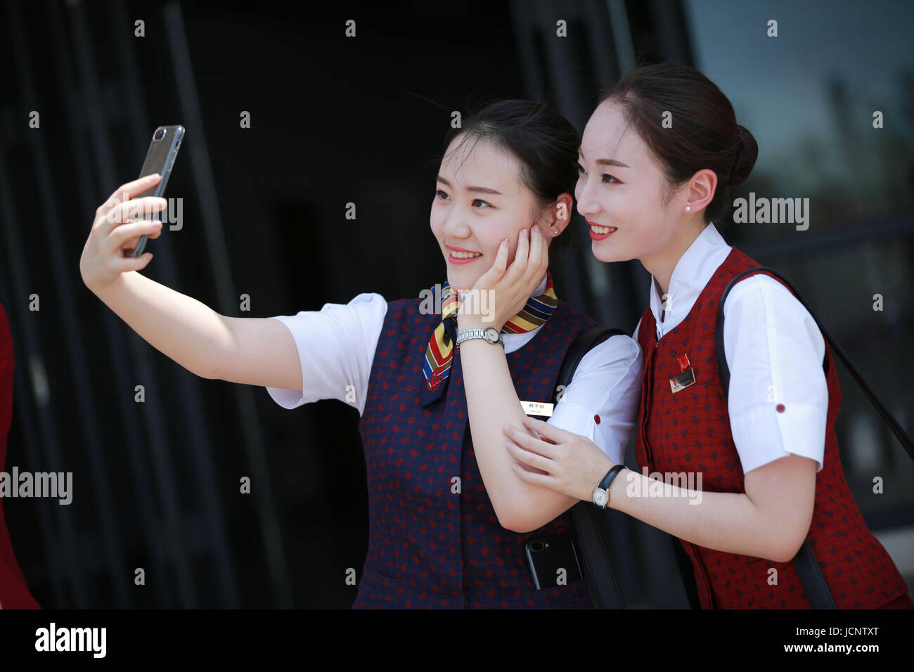 Tianjin. 16th June, 2017. Students in uniforms take selfies at a ...